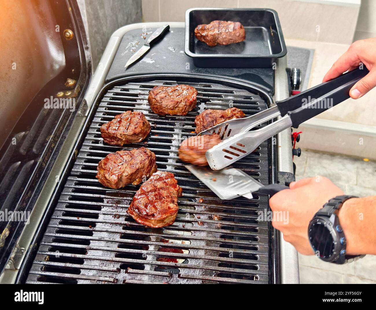 Sizzling grilled meat that showcases a perfect char Stock Photo - Alamy