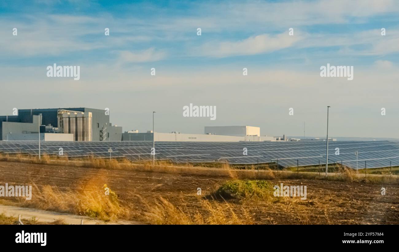 Aerial view of large sustainable electrical power plant with many rows ...
