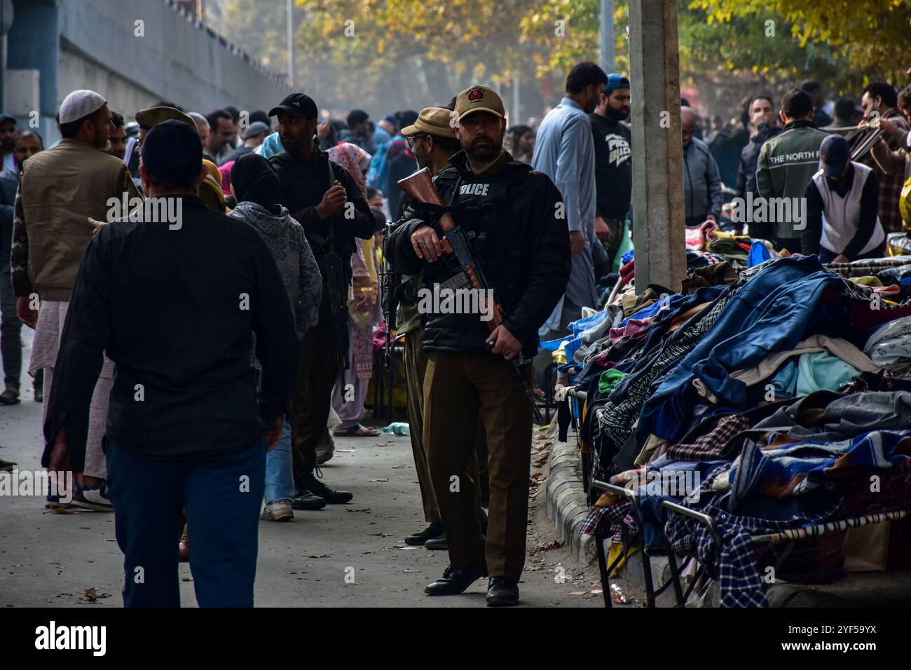 A trooper stands alert near the spot after a grenade attack at a Sunday market in Srinagar, the ...