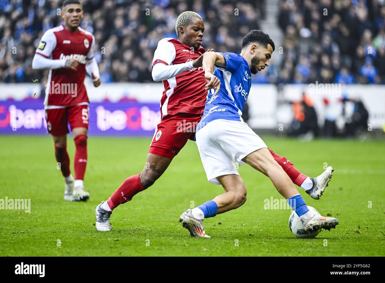 Genk, Belgium. 03rd Nov, 2024. Antwerp's Victor Udoh and Genk's Zakaria ...