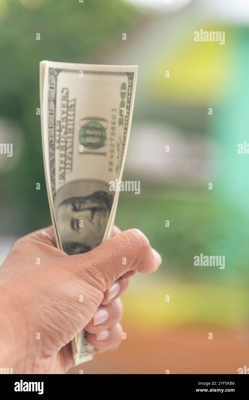 Hand holding loan money dollar bank note give financial payment. Man ...