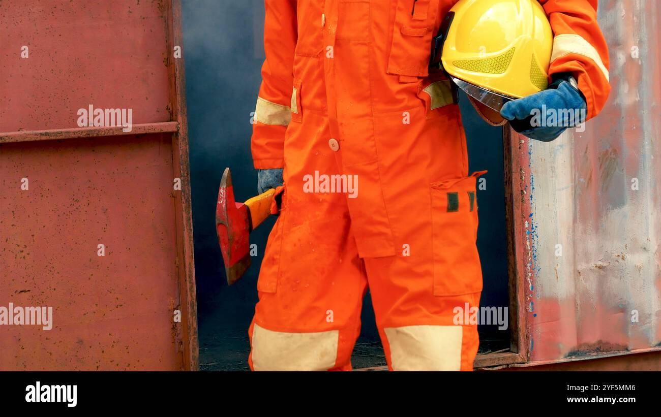 Firefighter fighting with flame using fire hose chemical water foam ...
