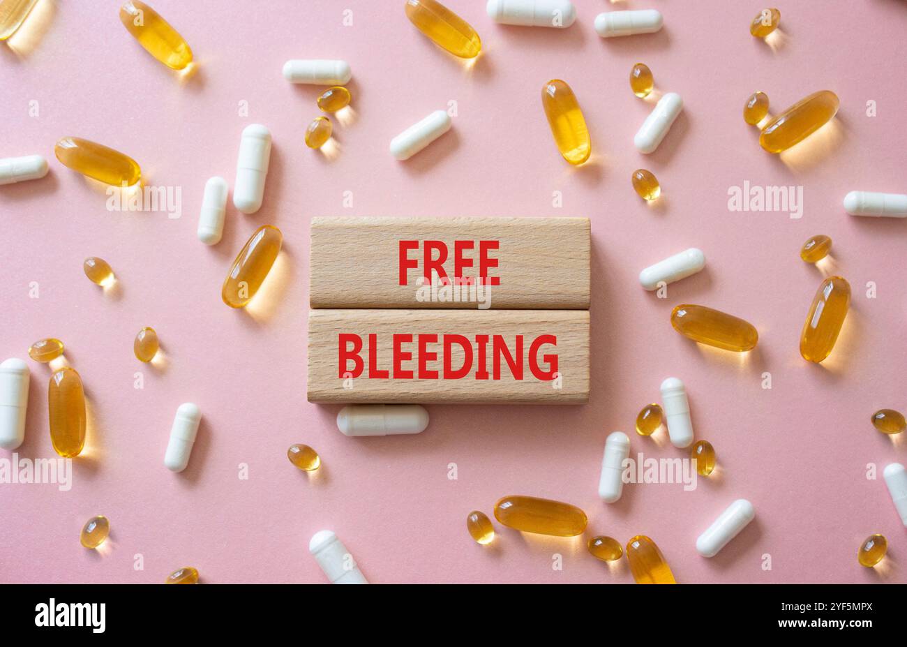 Free bleeding symbol. Concept words Free bleeding on wooden blocks ...