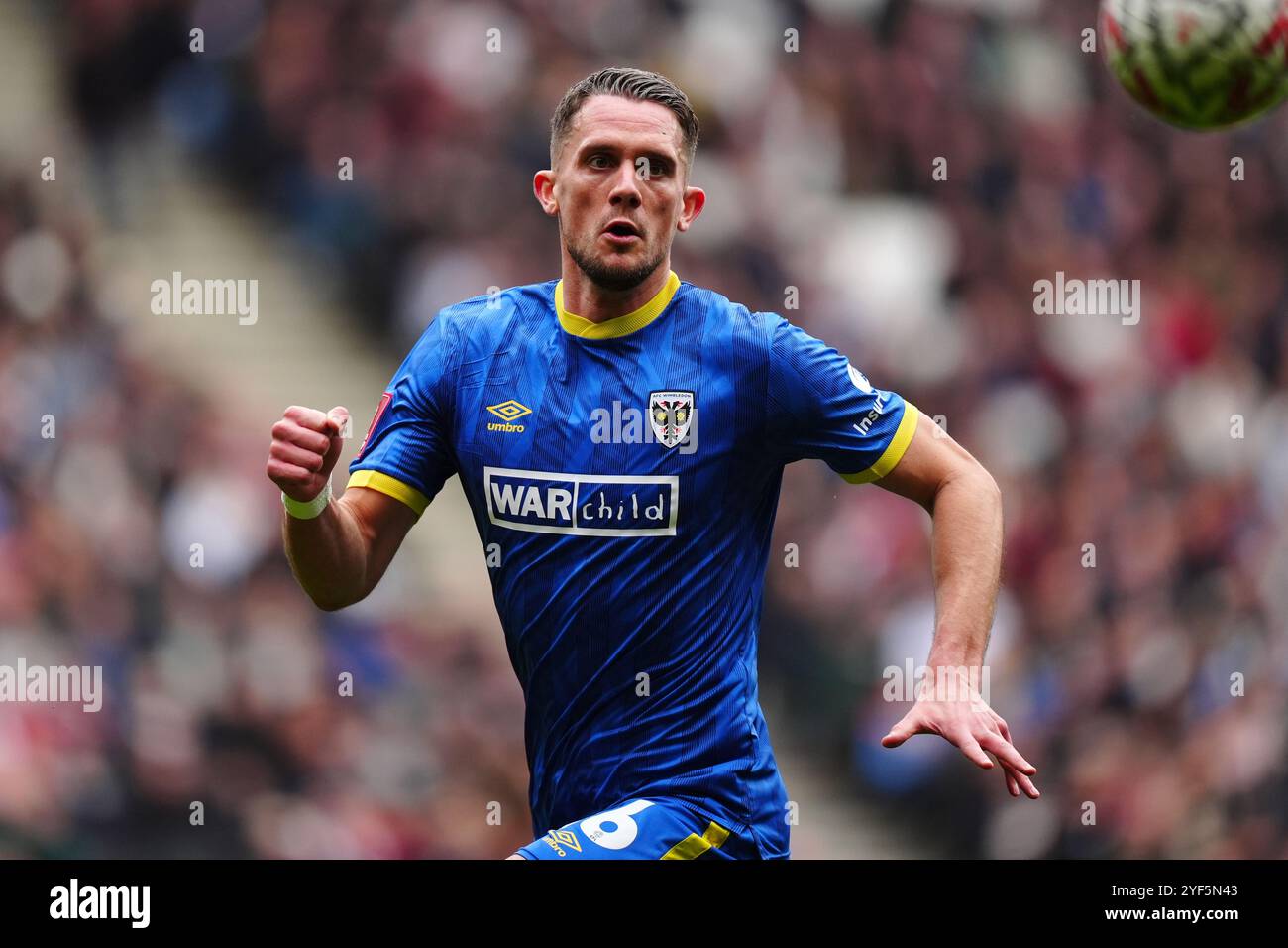AFC Wimbledon's James Ball during the Emirates FA Cup first round match ...