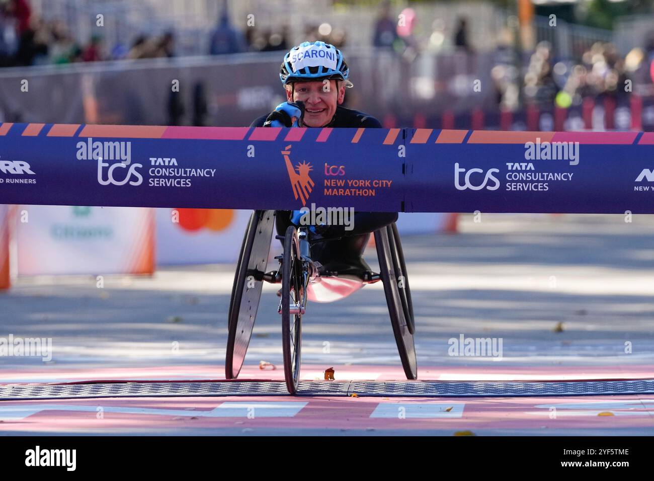 Susannah Scaroni crosses the finish line to win the women's wheelchair ...