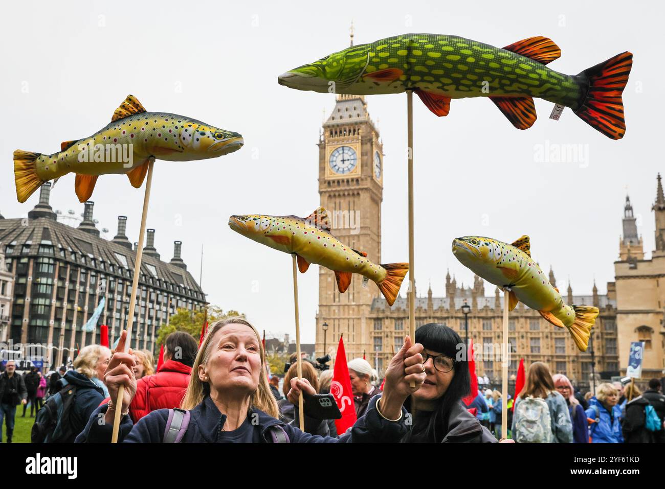London, UK. 03rd Nov, 2024. Protesters with fish 'swimming' around the ...