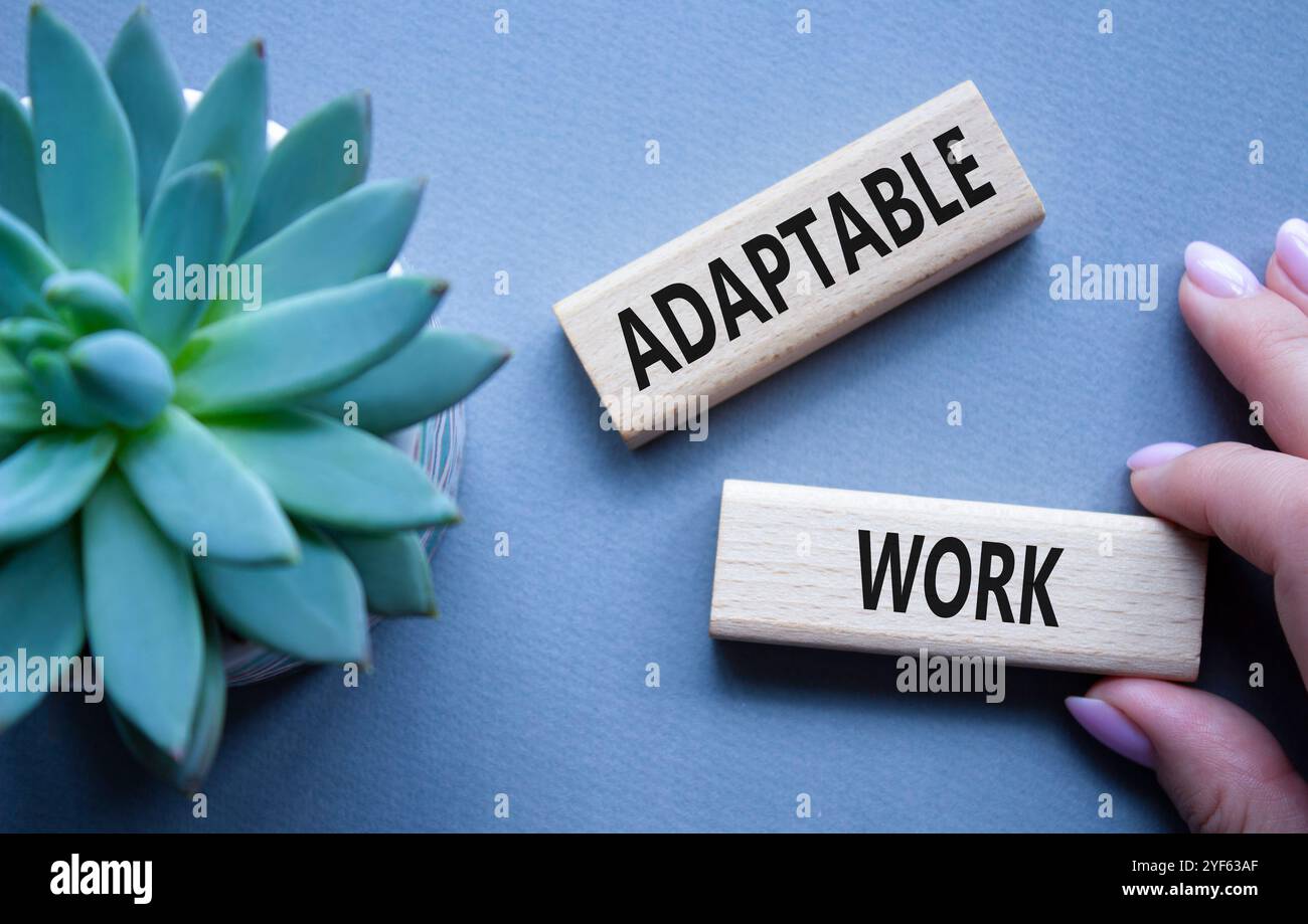 Adaptable work symbol. Concept word Adaptable work on wooden blocks ...