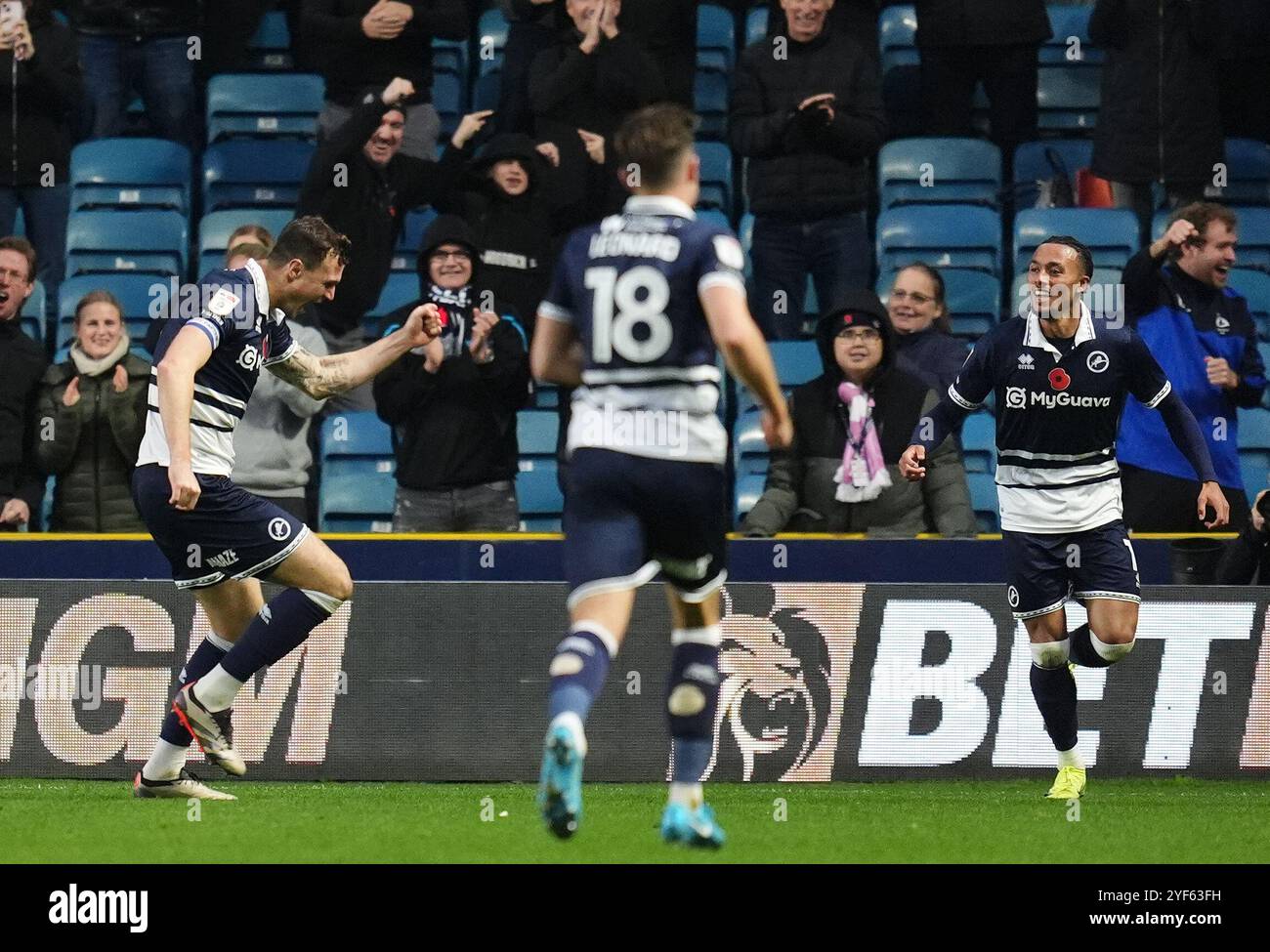 Millwall's Jake Cooper (left) celebrates scoring their side's first ...