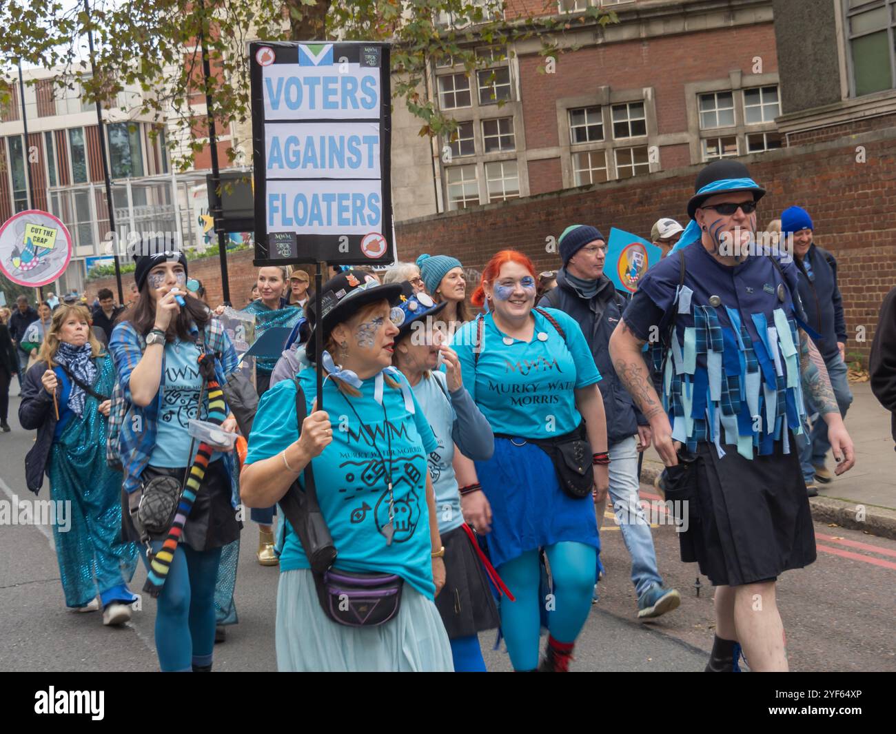 London, UK. 3 Nov 2024. Marches wear blue for water flood the streets ...