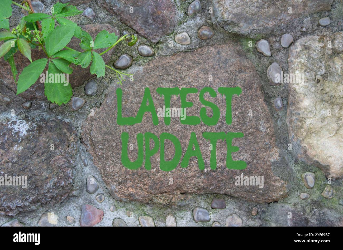 Latest update symbol. Stone wall with words Latest update. Beautiful ...