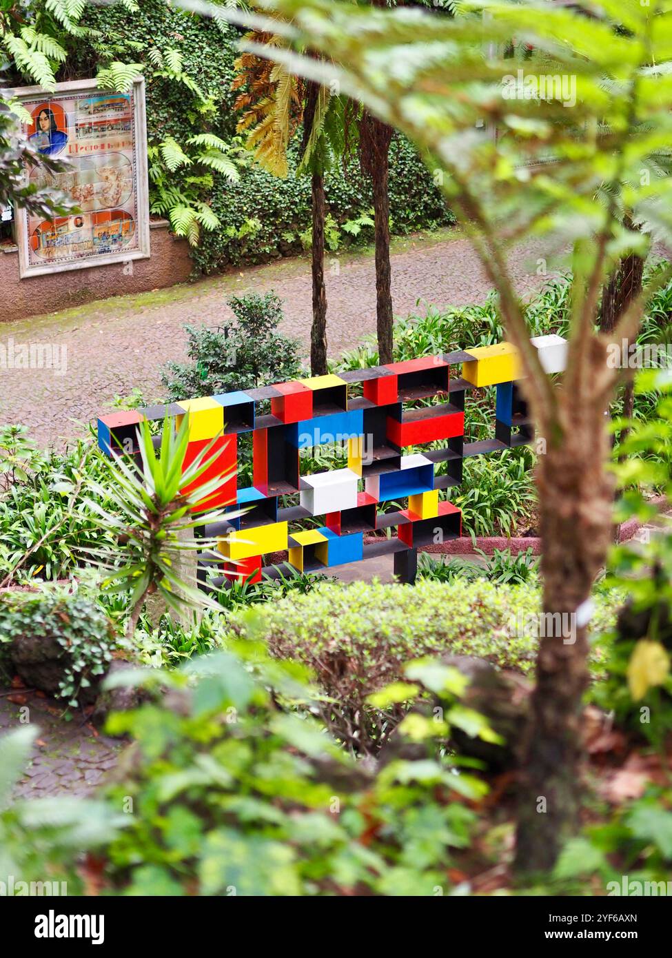 A striking and abstract art installation, made up of colorful shapes ...