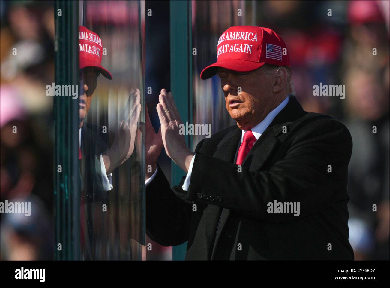 Republican presidential nominee former President Donald Trump measures ...