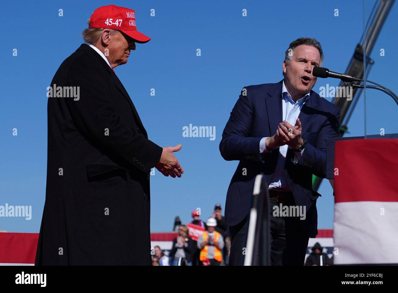 Republican presidential nominee former President Donald Trump listens ...