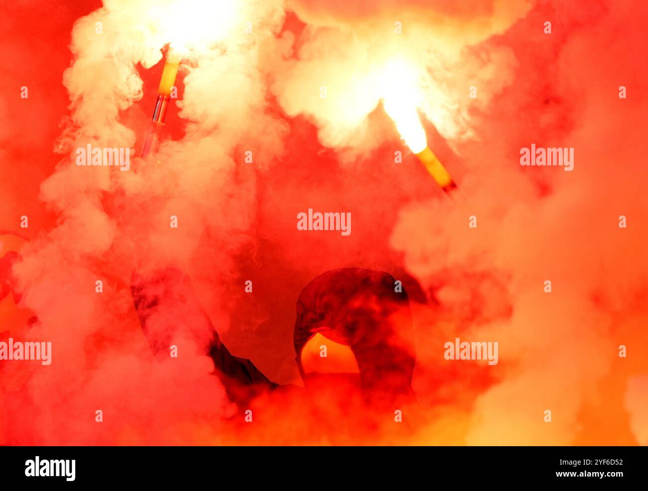 A general view a fan setting off flares ahead of the Viaplay Cup semi ...