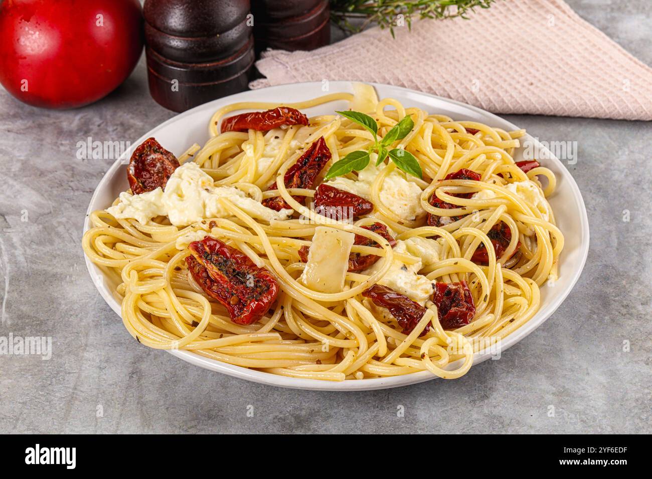 Italian pasta spaghetti with stracciatella and tomato Stock Photo - Alamy