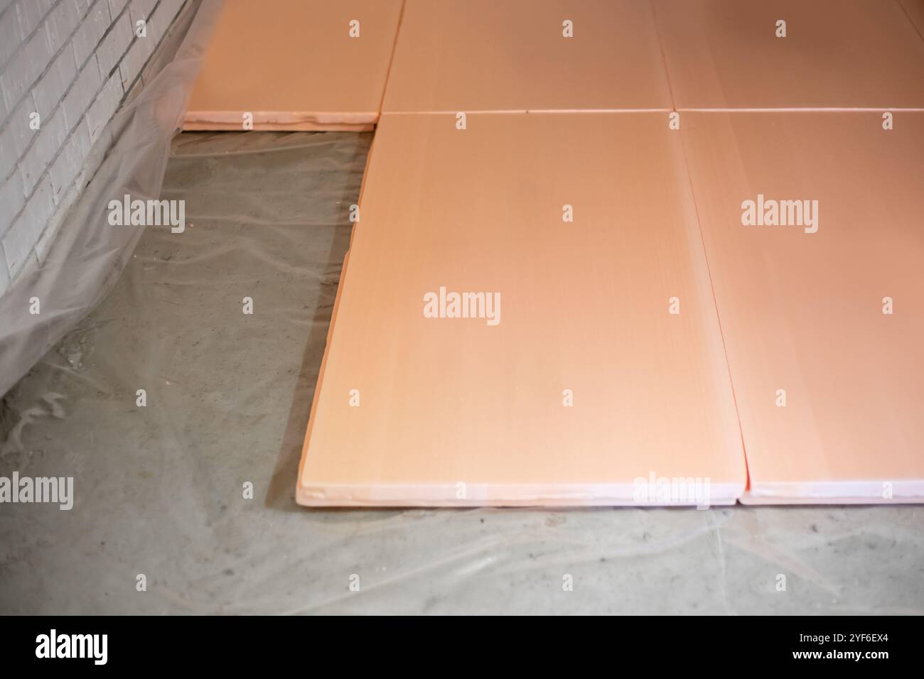 Laying polystyrene foam on the floor. Thermal insulation of the floor ...