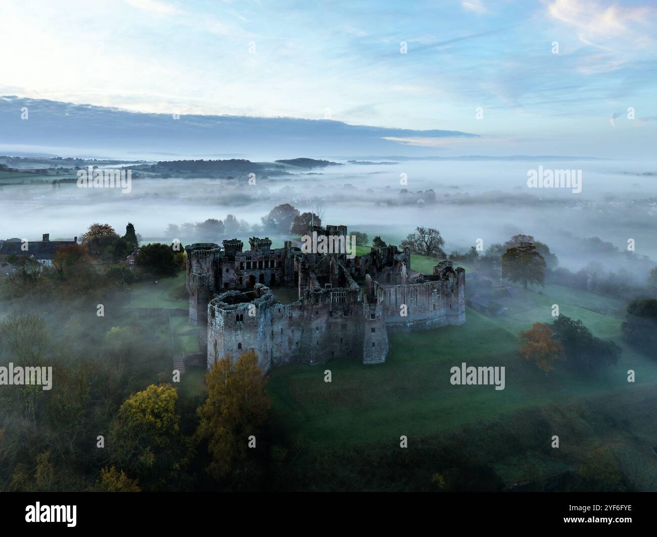 Raglan Castle in the fog at dawn, Monmouthshire, Wales, England Stock ...