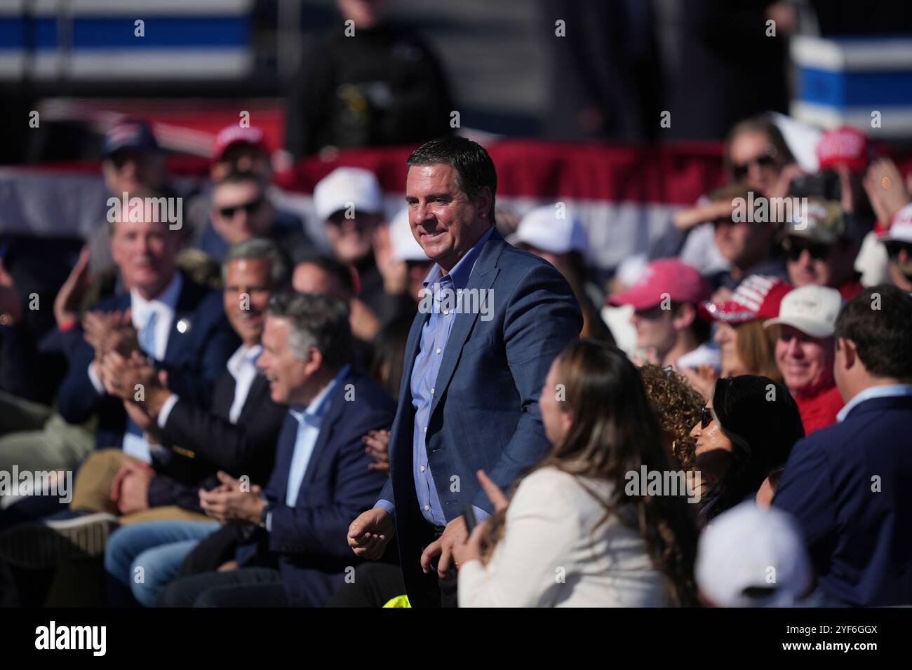 Devin Nunes stands during a campaign rally with Republican presidential ...