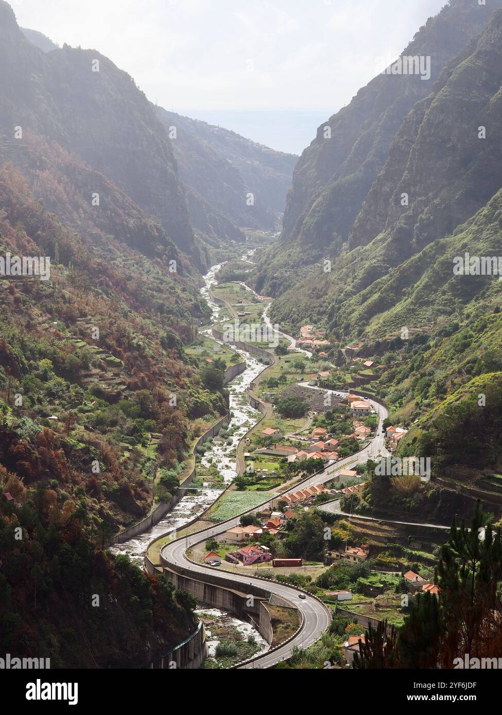 Nestled between stunning cliffs hi-res stock photography and images - Alamy