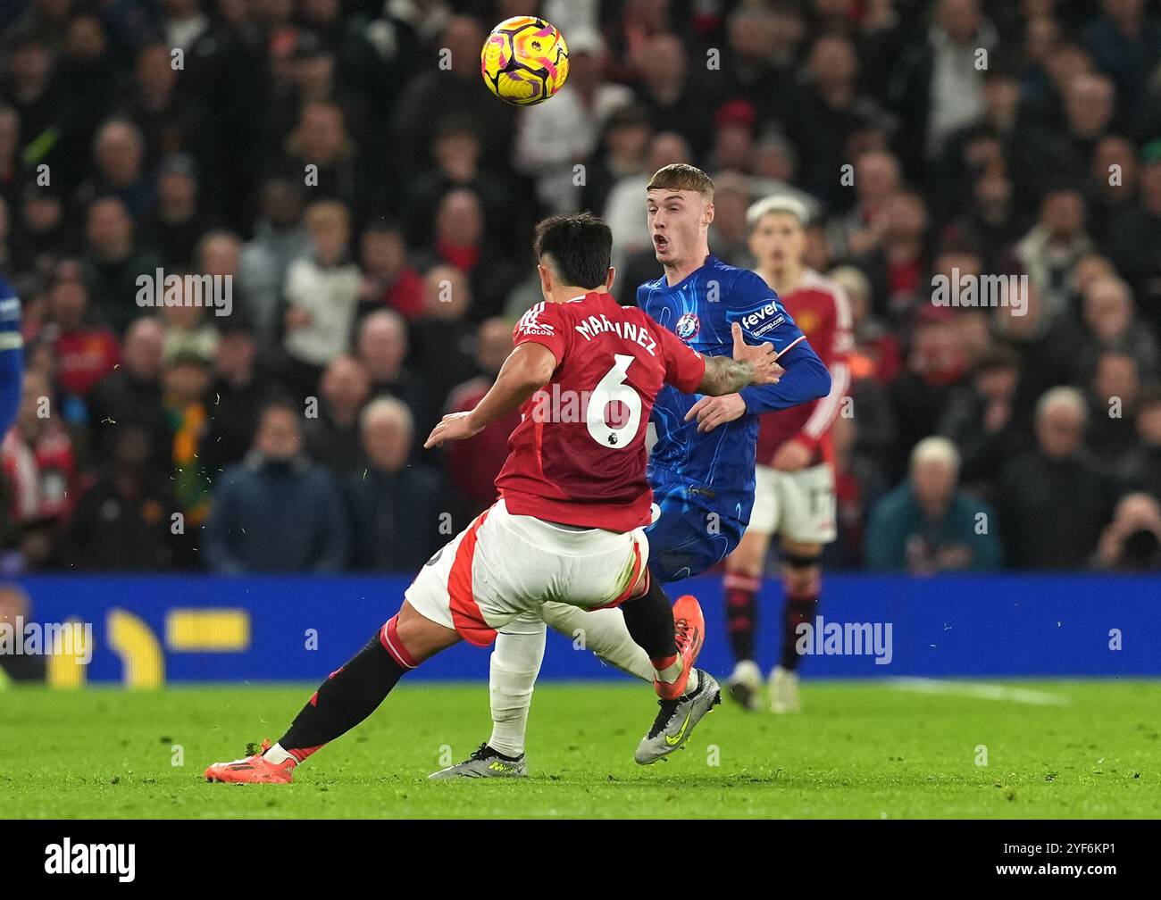 Manchester United's Lisandro Martinez (left) challenges Chelsea's Cole ...