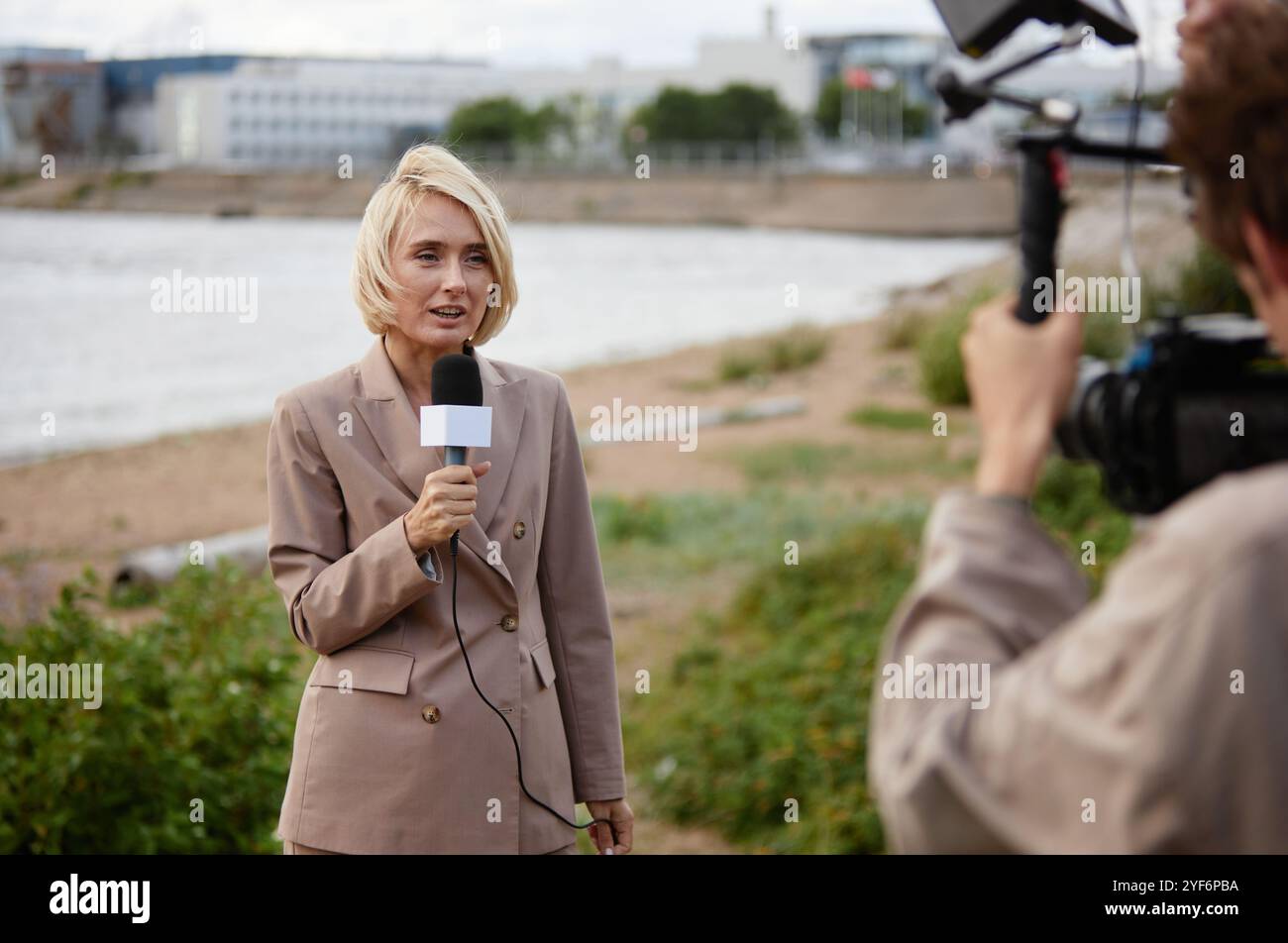 Female blonde reporter on camera hi-res stock photography and images ...