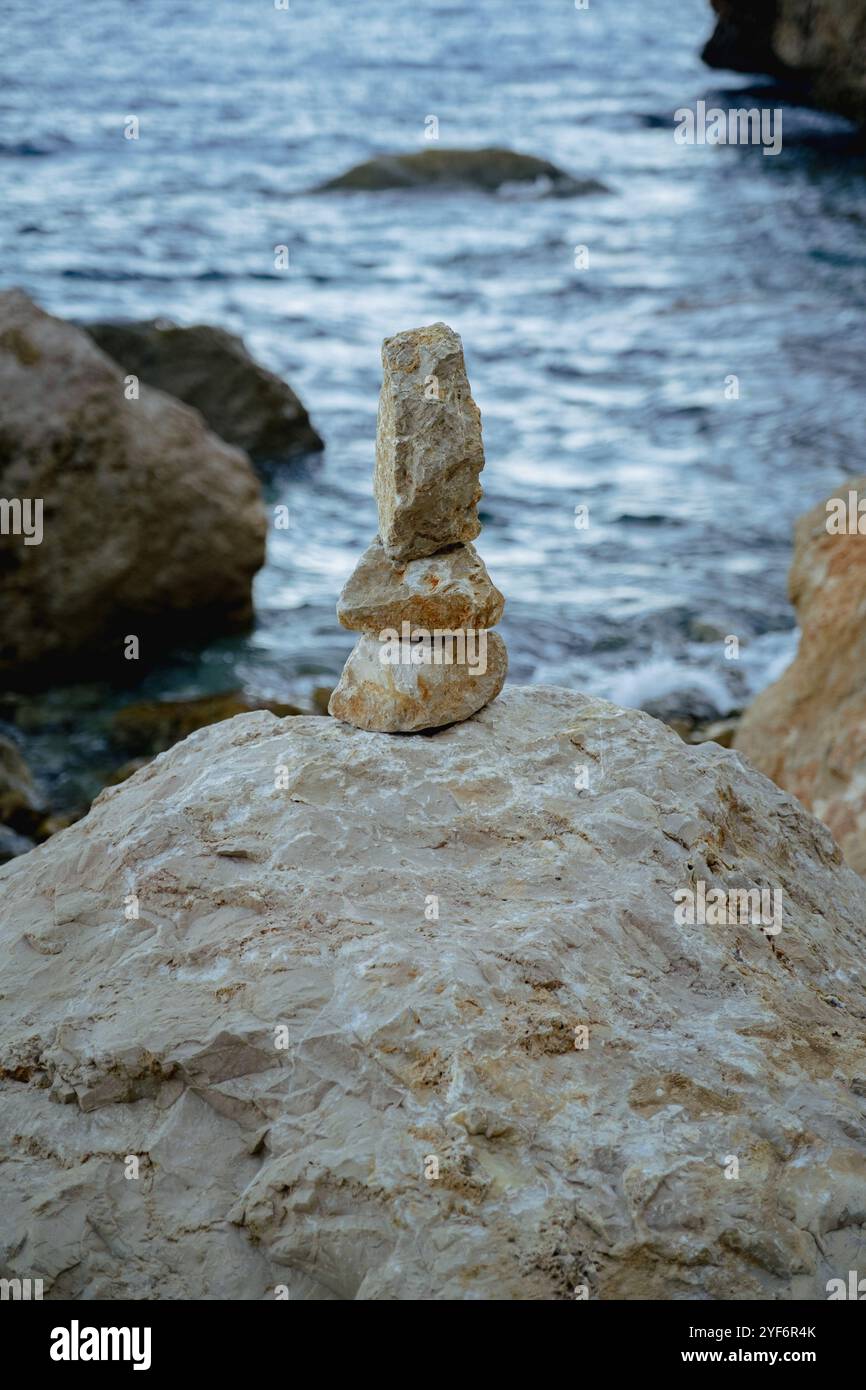 Stone pyramids on the beach Stock Photo - Alamy