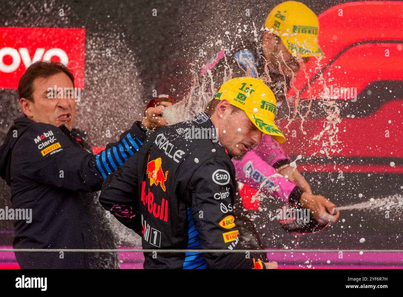 Red Bull technical chief Pierre Wache sprays driver Max Verstappen, of ...
