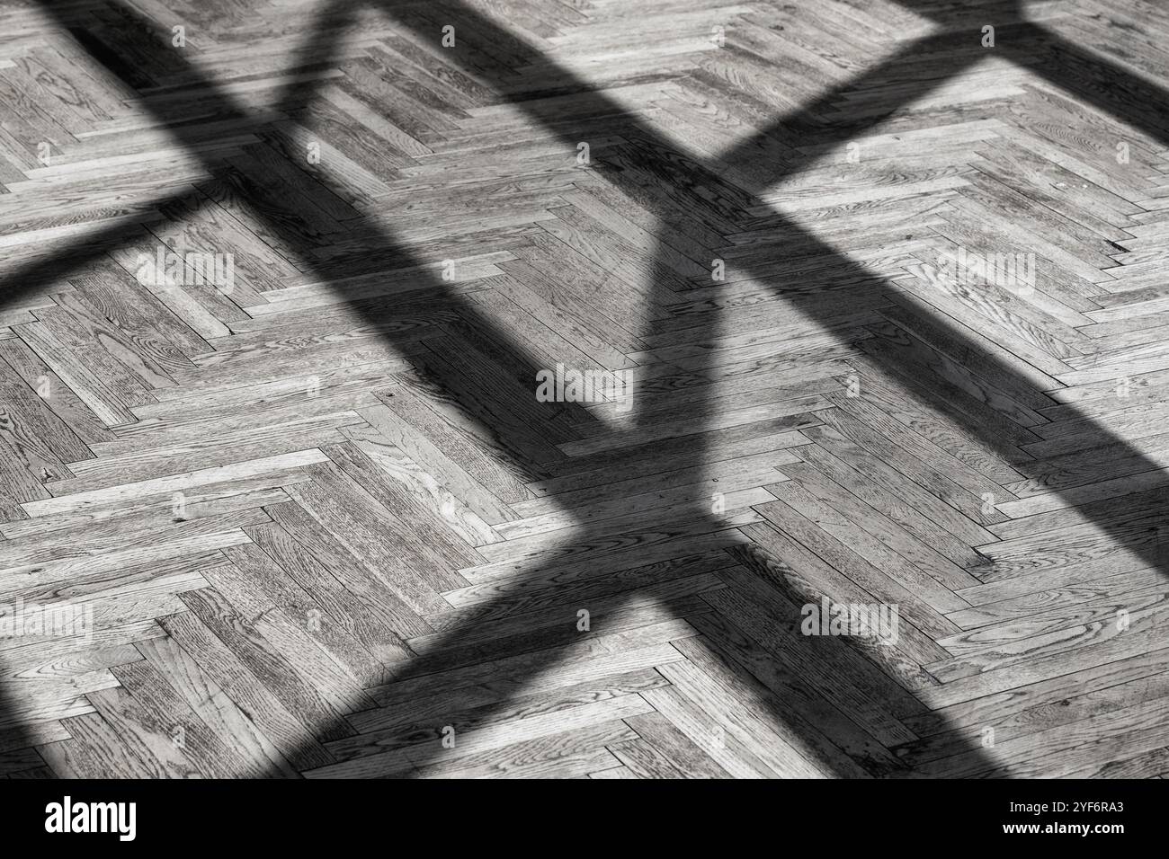 Abstract background with straight shadows from a window frame on old ...