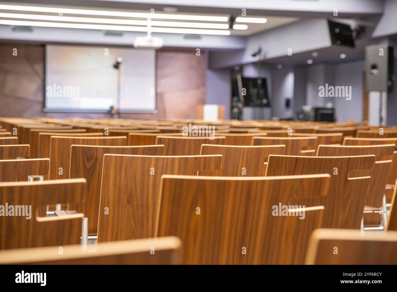 Interior with screen and chairs of an empty hall for conferences and ...