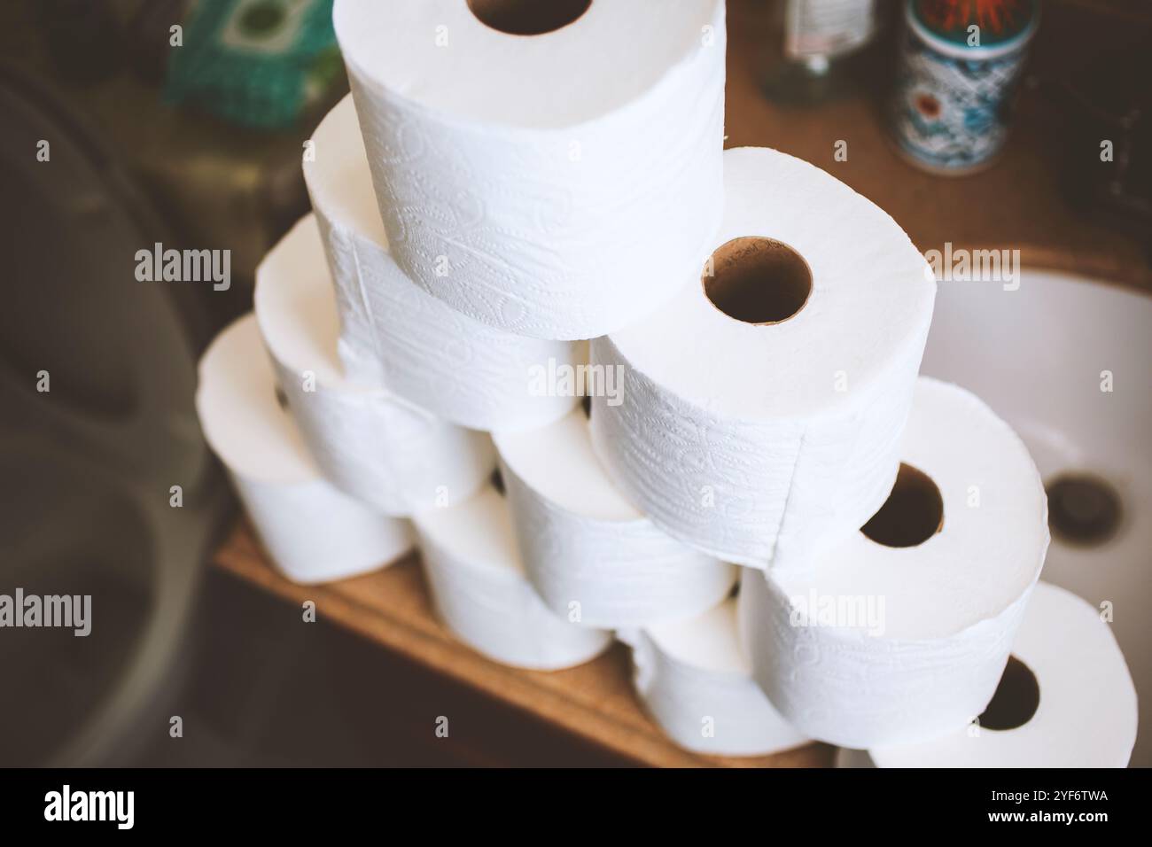 A view of a toilet paper roll pyramid in a bathroom setting Stock Photo ...