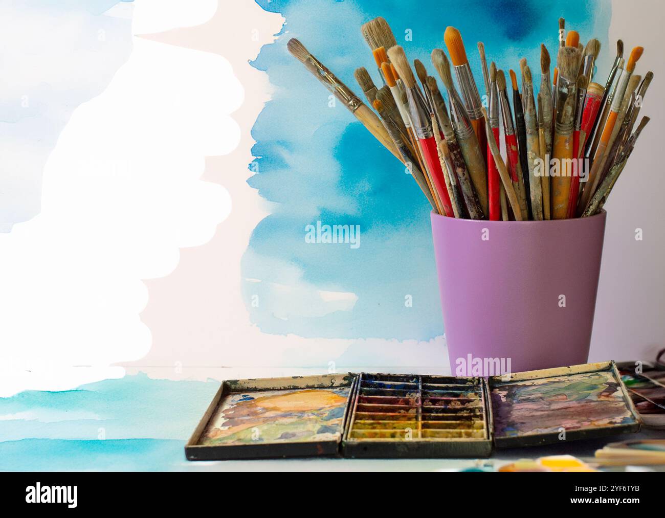 Pot of brushes and watercolor color palette Stock Photo - Alamy