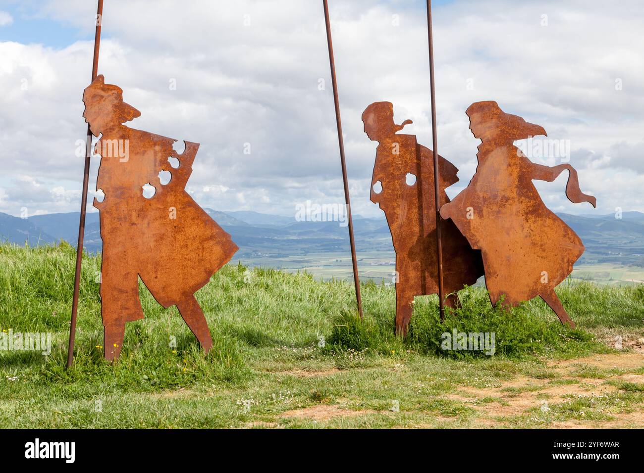 On the Camino de Santiago, metal sculptures of pilgrims walk toward ...