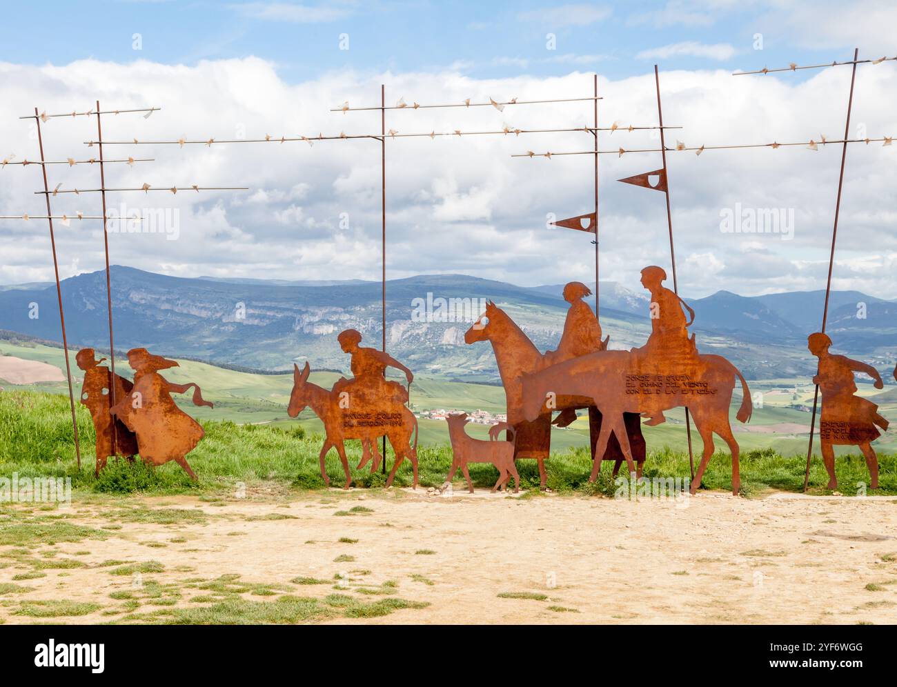 On the Camino de Santiago, metal sculptures of pilgrims walk toward ...