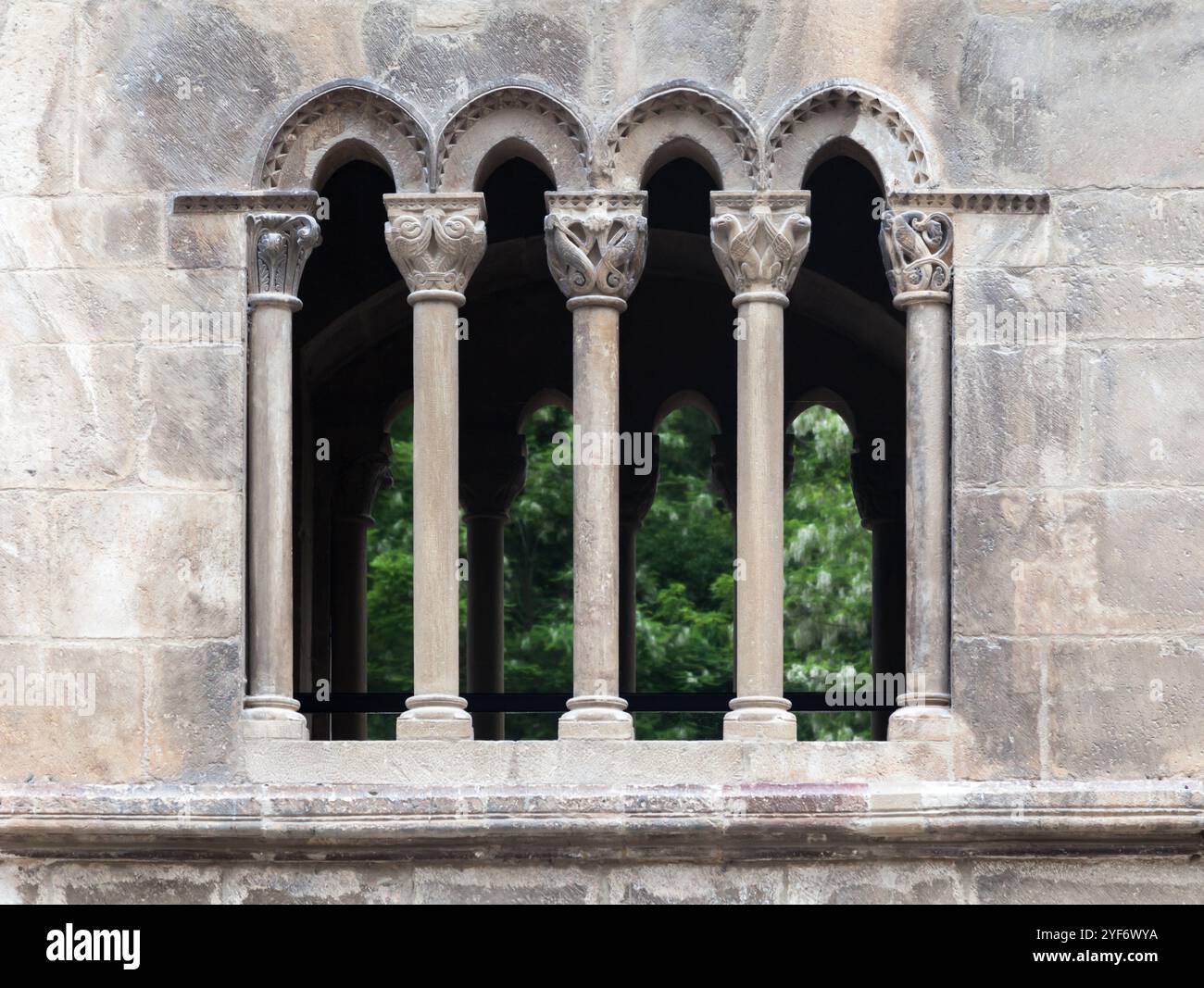 The elegant stone columns and arches reveal intricate carvings ...