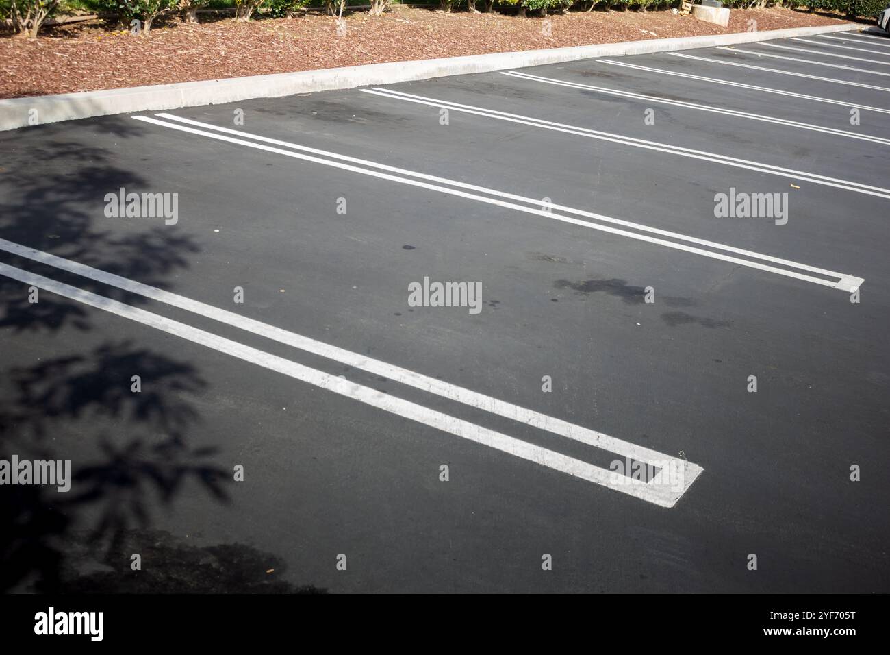 A view of empty parking lot stalls Stock Photo - Alamy
