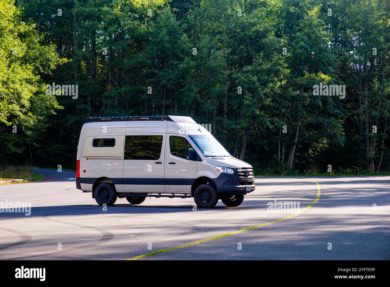 A new Mercedes Benz with roof rack and running boards is built out to ...