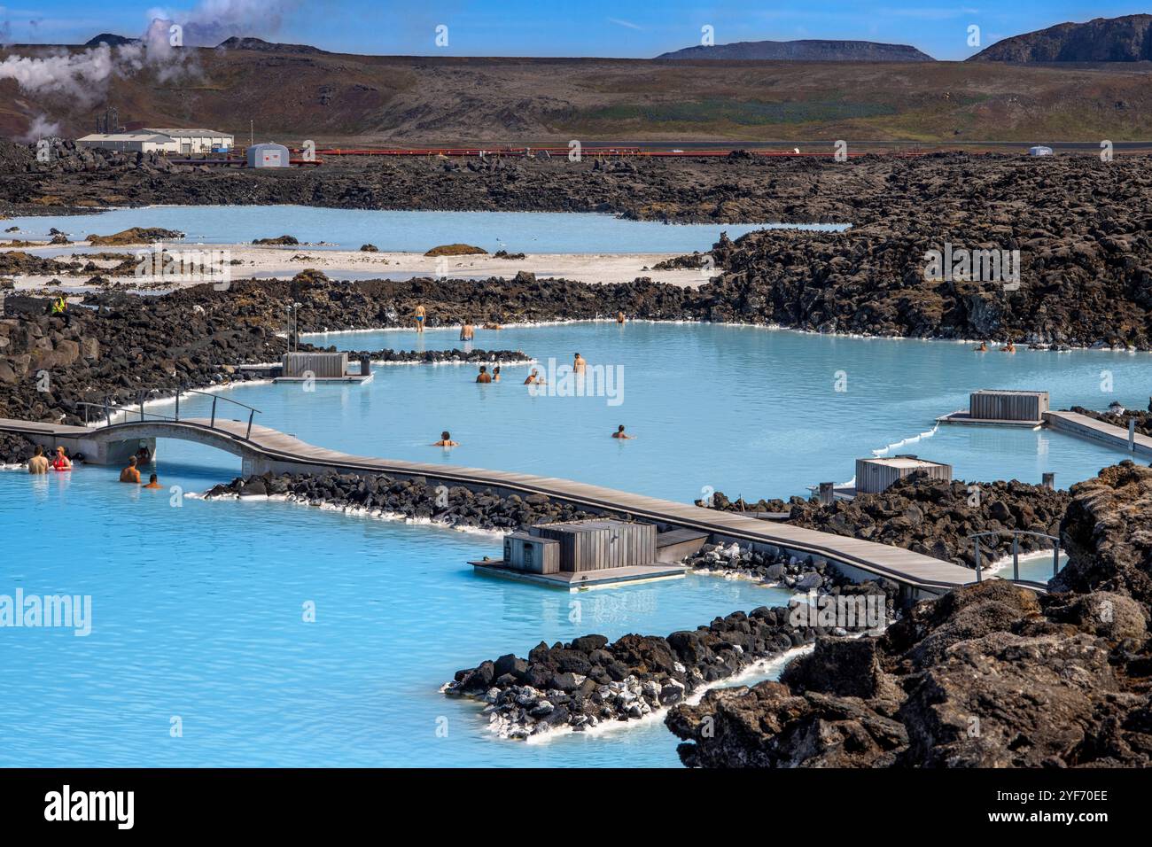 People bathing in The Blue Lagoon, a geothermal bath resort in Iceland ...