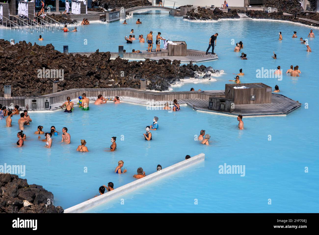 People bathing in The Blue Lagoon, a geothermal bath resort in Iceland ...