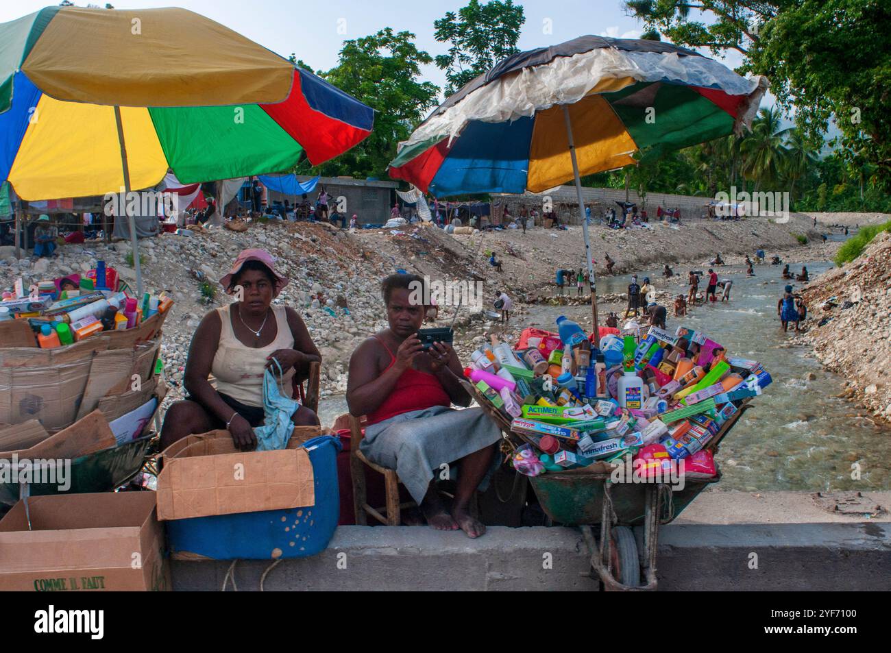 Garbage and street sellers on banks of Riviere de la Cosse, Jacmel ...