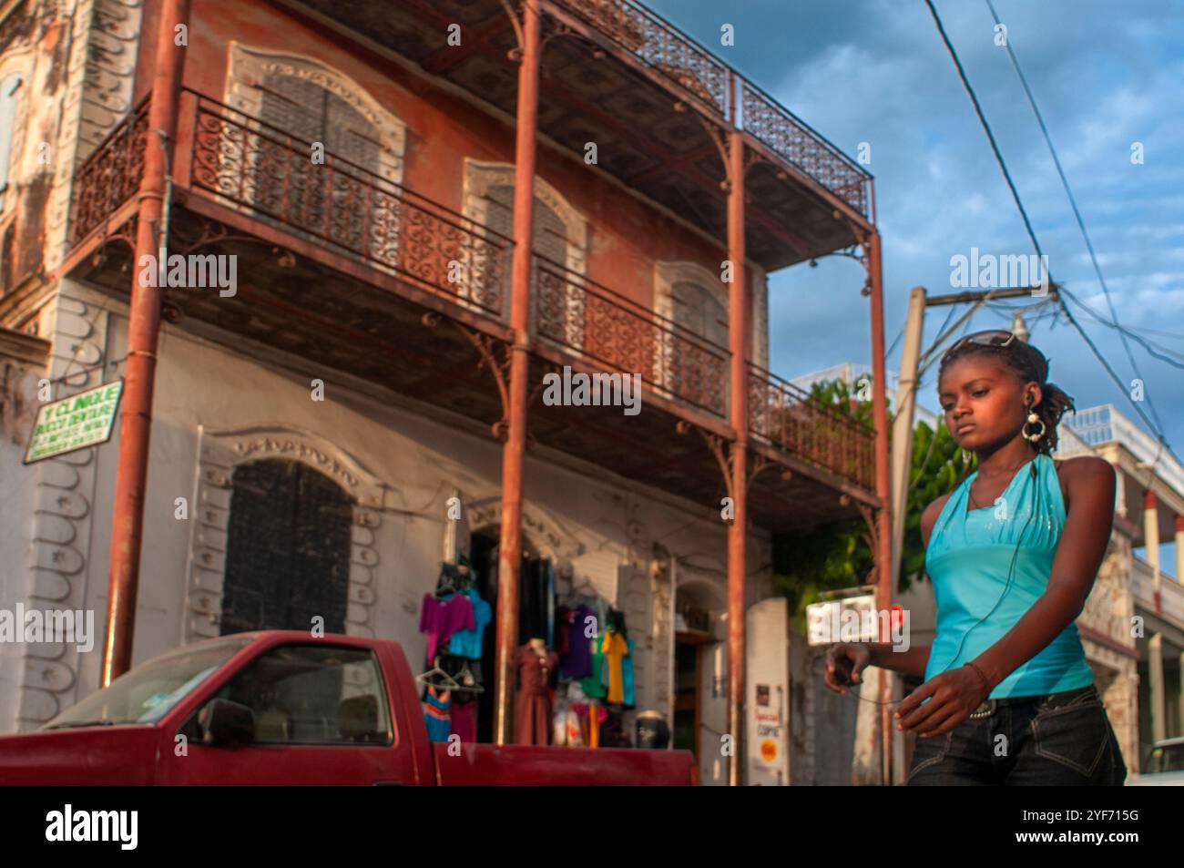 Girl and the colonial houses in the historic colonial old town, Jacmel ...