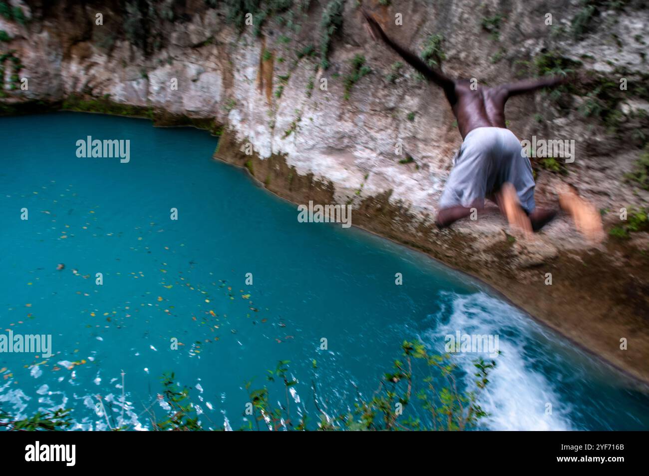 Exploring the cobalt waters of Bassin Bleu waterfall composed of bassin ...