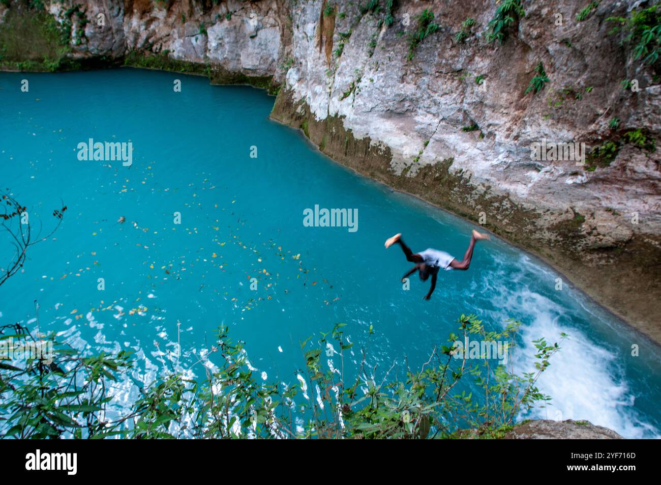 Exploring the cobalt waters of Bassin Bleu waterfall composed of bassin ...