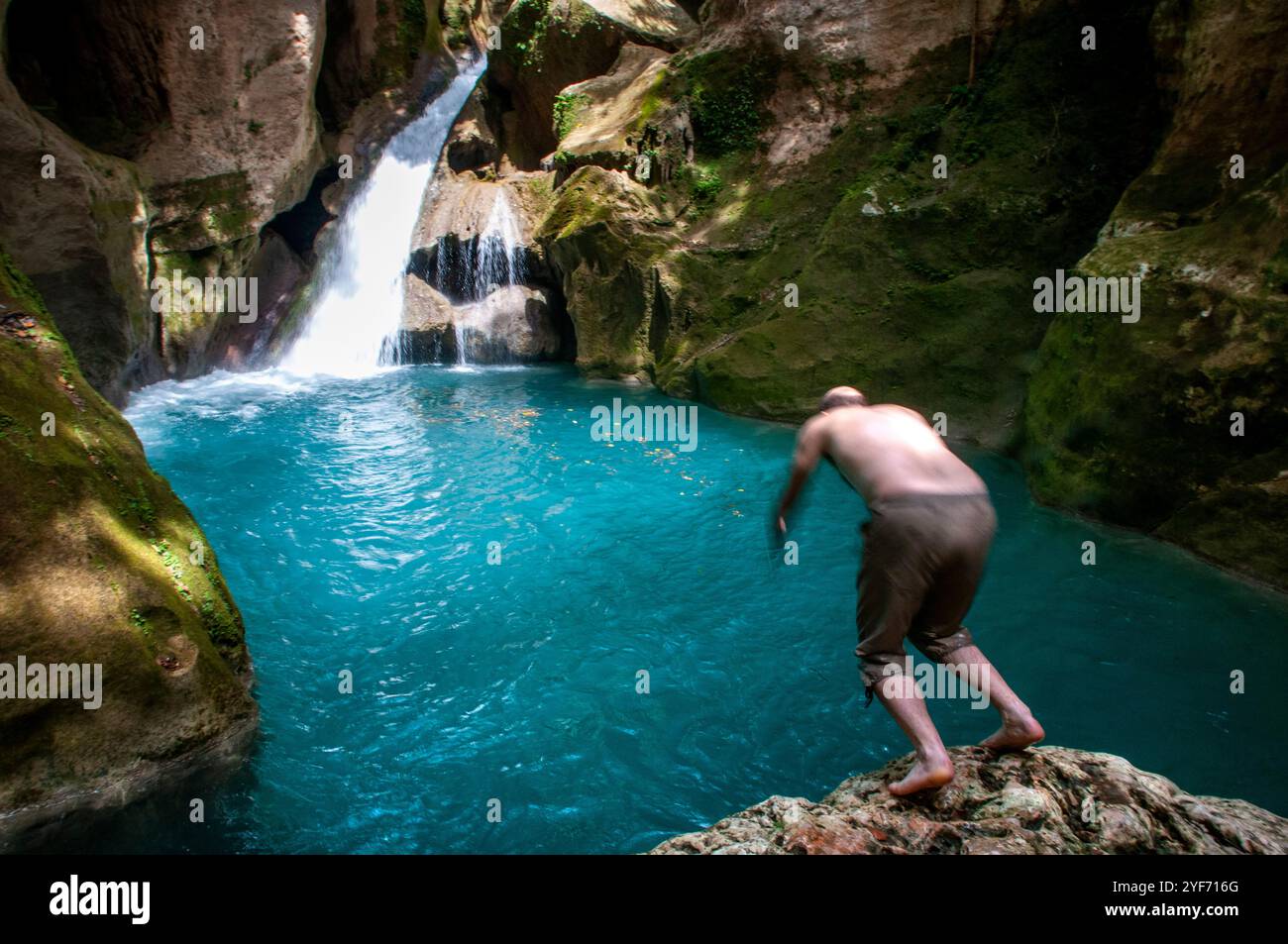 Exploring the cobalt waters of Bassin Bleu waterfall composed of bassin ...