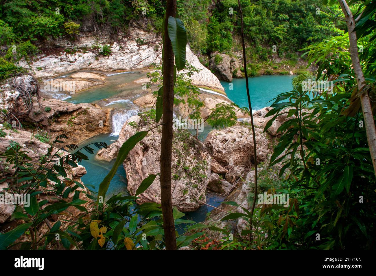 Exploring the cobalt waters of Bassin Bleu waterfall composed of bassin ...