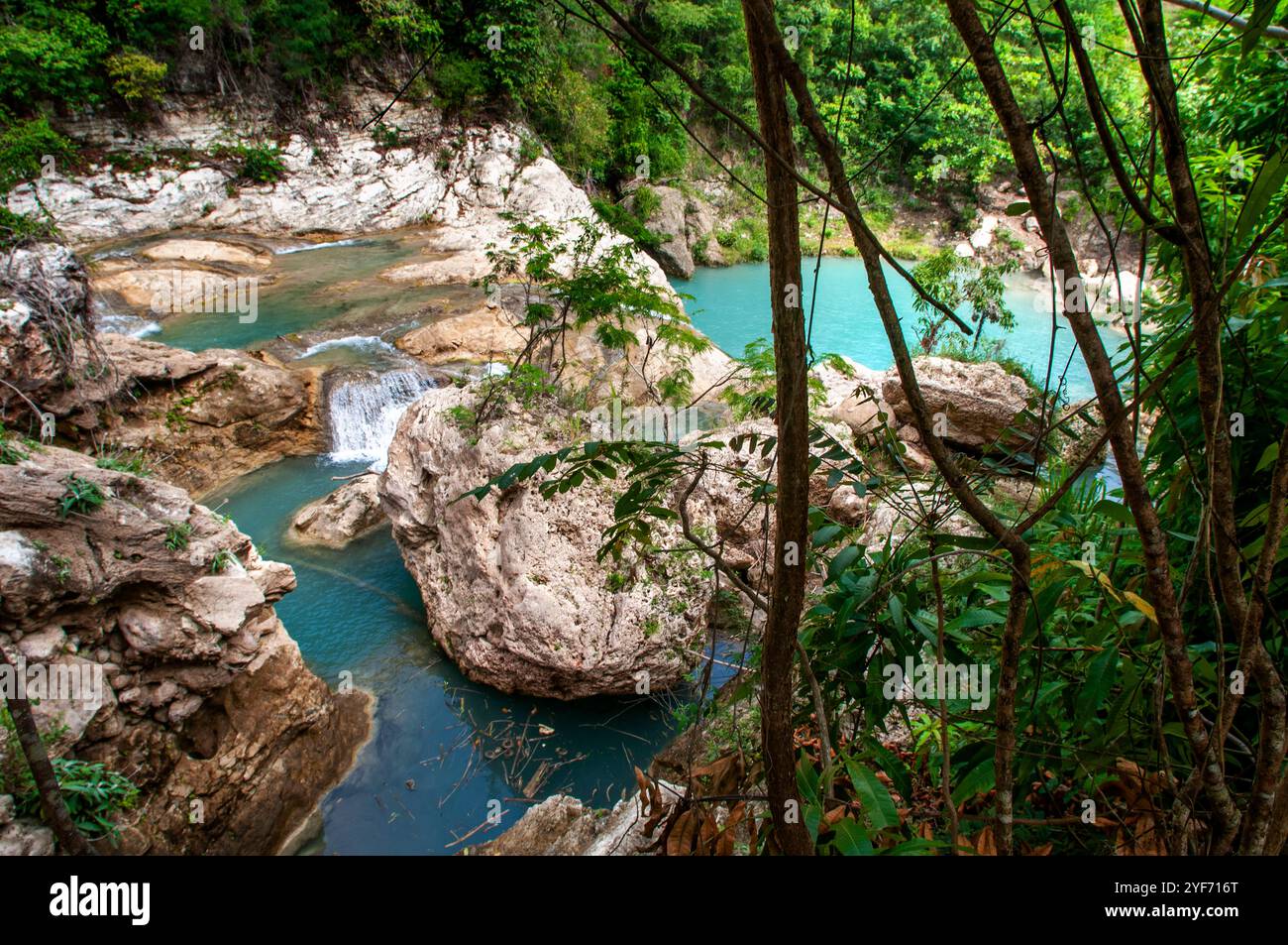 Exploring the cobalt waters of Bassin Bleu waterfall composed of bassin ...