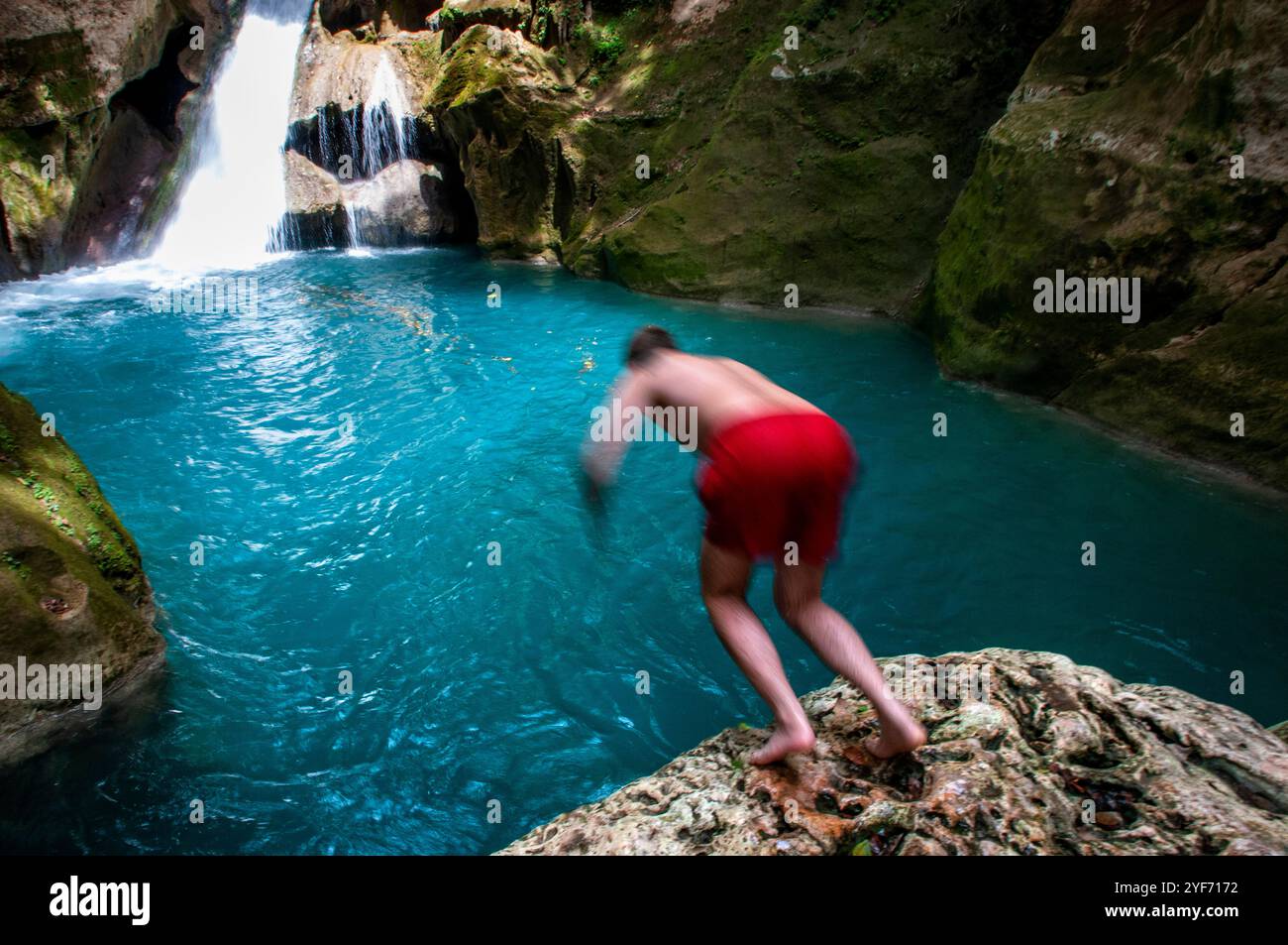 Exploring the cobalt waters of Bassin Bleu waterfall composed of bassin ...
