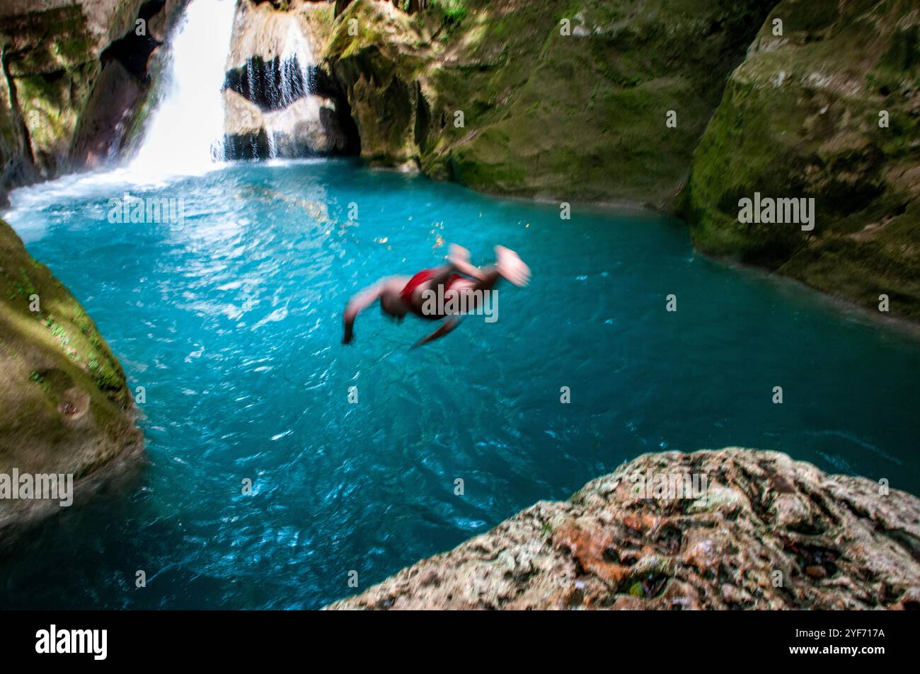 Exploring the cobalt waters of Bassin Bleu waterfall composed of bassin ...