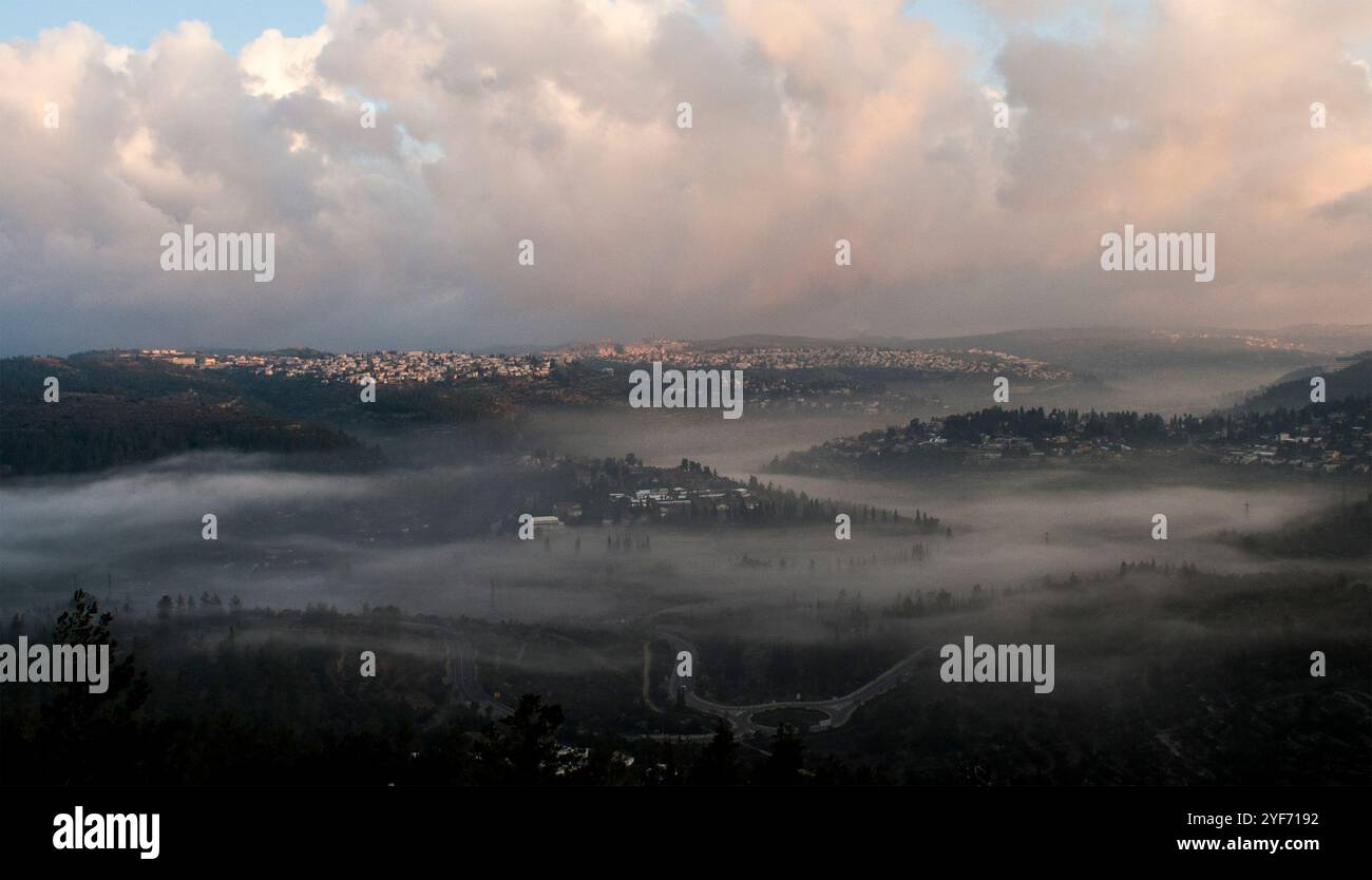 Early morning winter fog enshrouds the valley of Ein Kerem on the ...