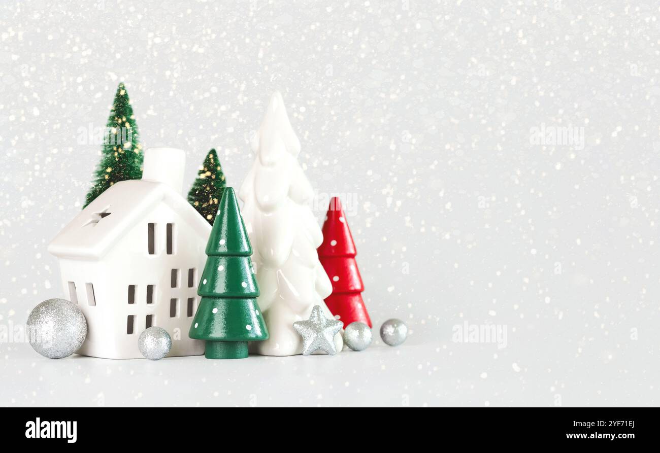 Christmas concept background. White houses next to Christmas balls and ...