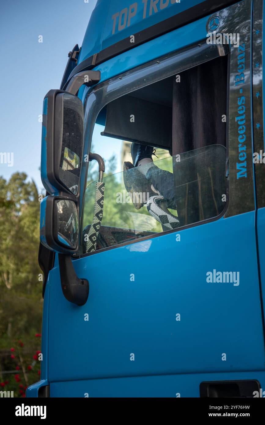 Amman, Jordan - 29 April 2023: Truck driver taking a break sleeping in ...